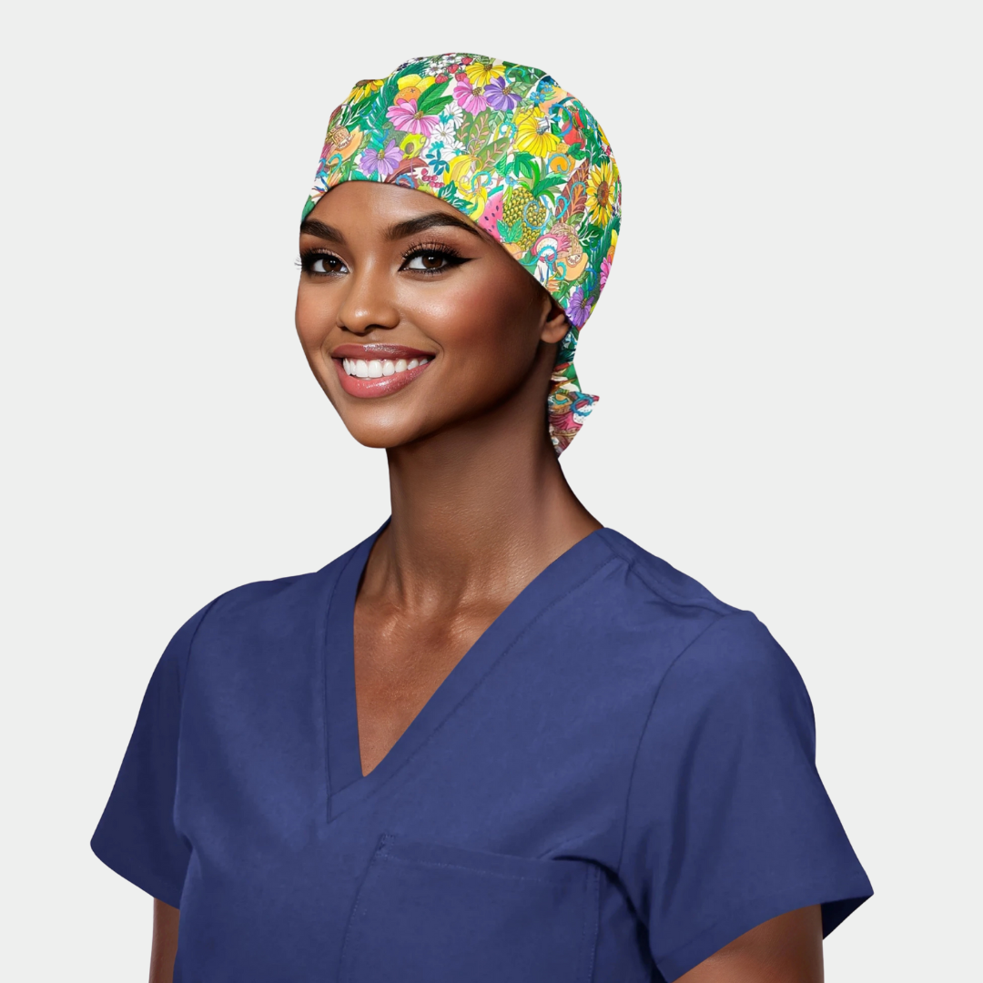 Person wearing a colorful floral scrub cap and blue scrub top on a plain background