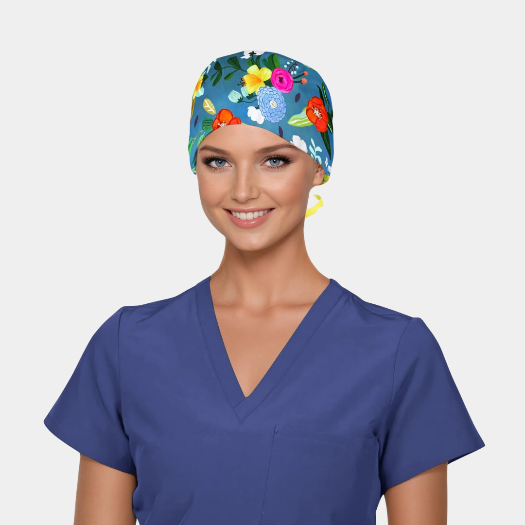 Person wearing a blue scrub top and a blue floral scrub cap on a light ...